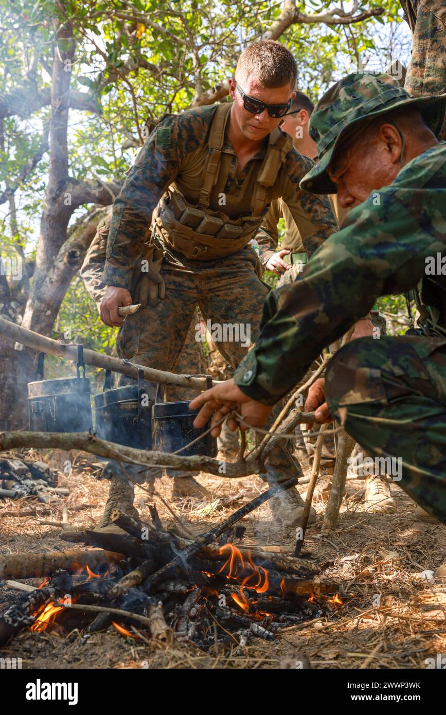 U.S. Marine Corps Cpl. Spencer Avery, left, a machine gunner assigned ...