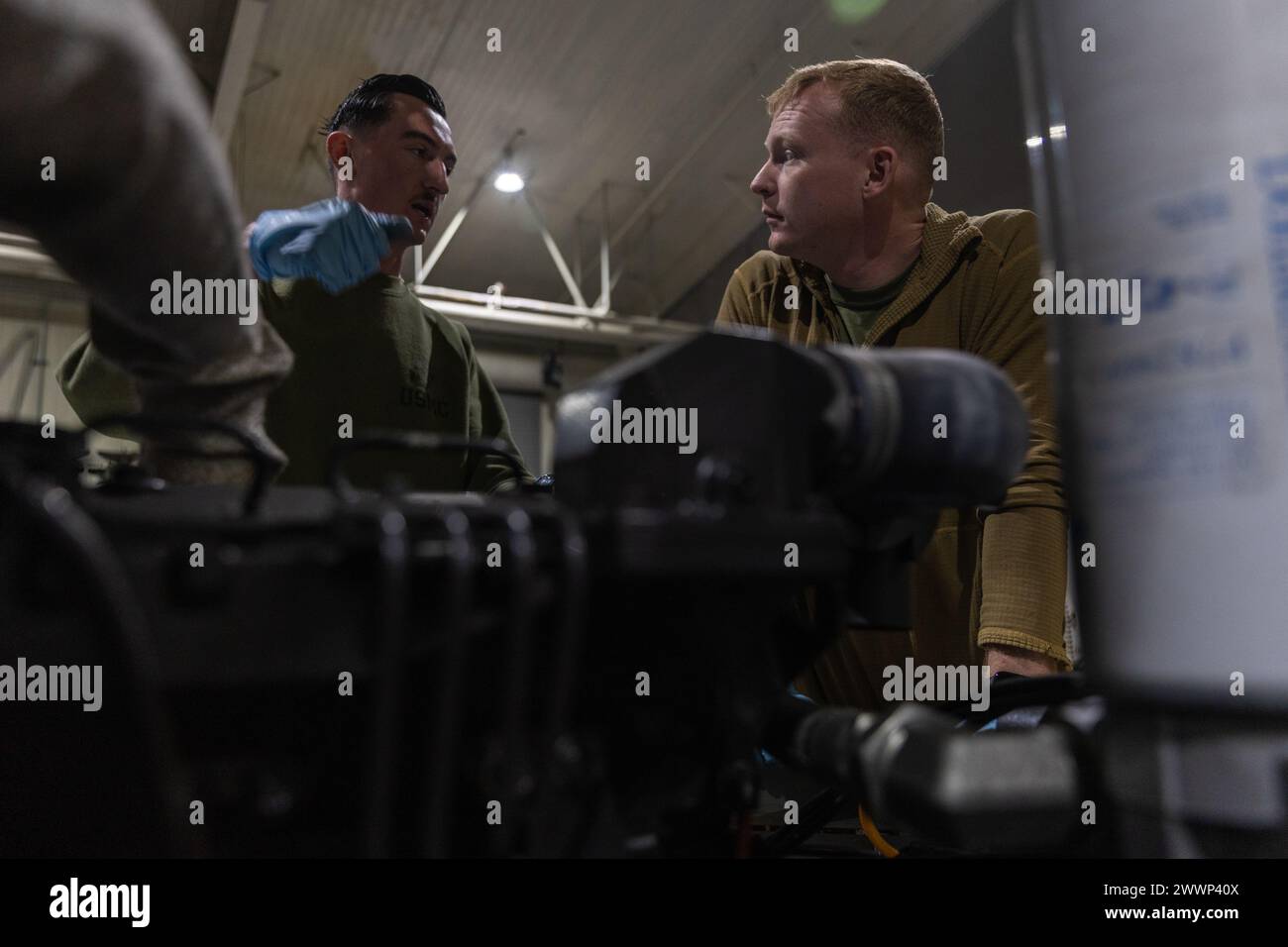 U.S. Marine Corps Cpl. Tron Rhodes, left, an aircraft maintenance ...