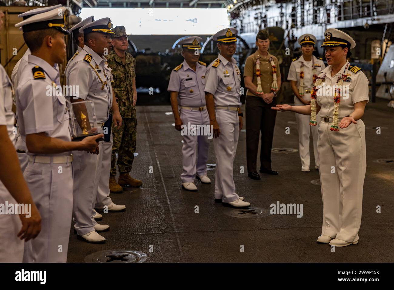 U.S. Navy Capt. Michel Brandt, right, commanding officer of the ...