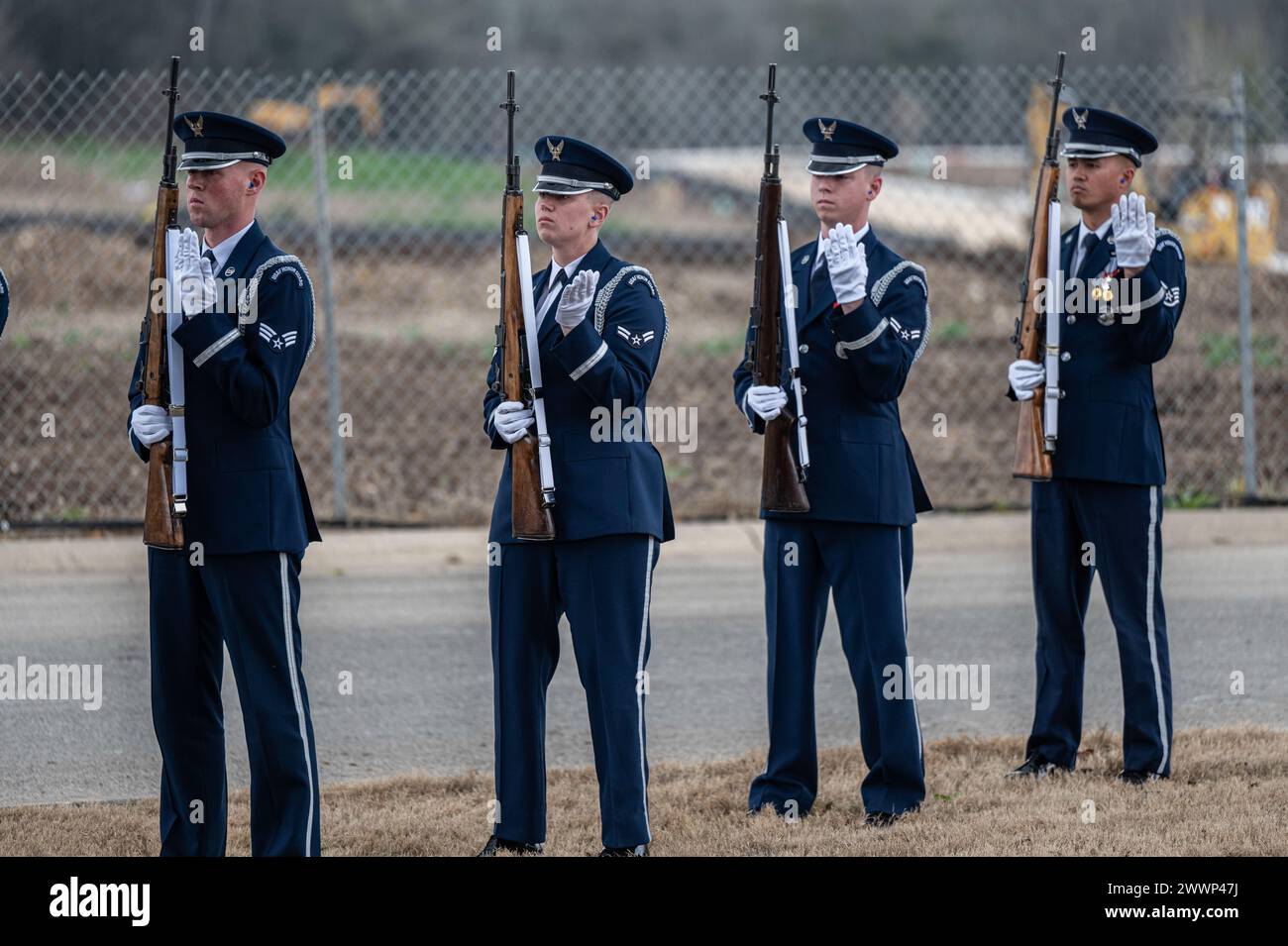 The U.S. Air Force Honor Guard firing party members perform a 21-gun ...