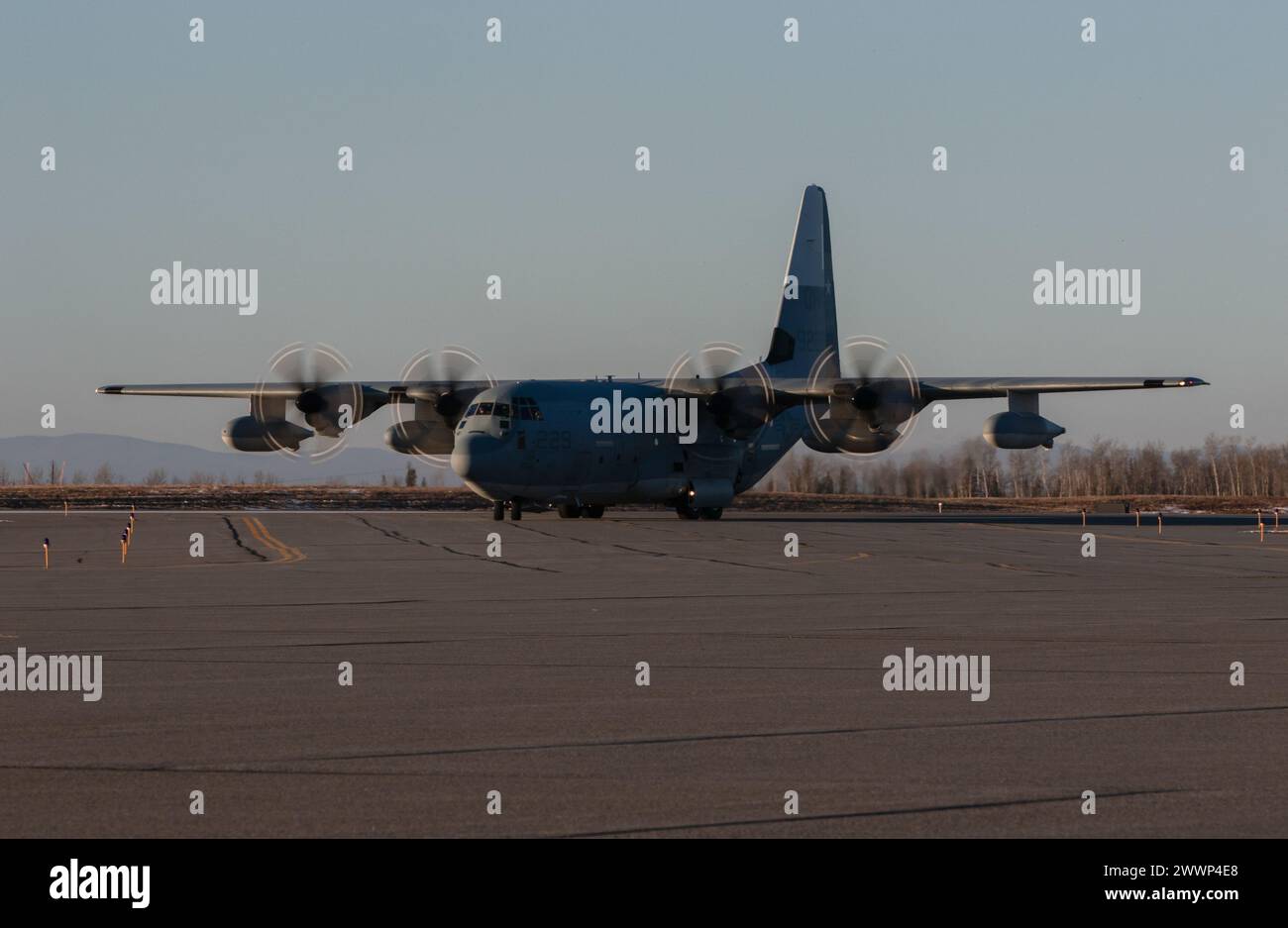 A C-130J Hercules, carrying a M142 High Mobility Artillery Rocket ...