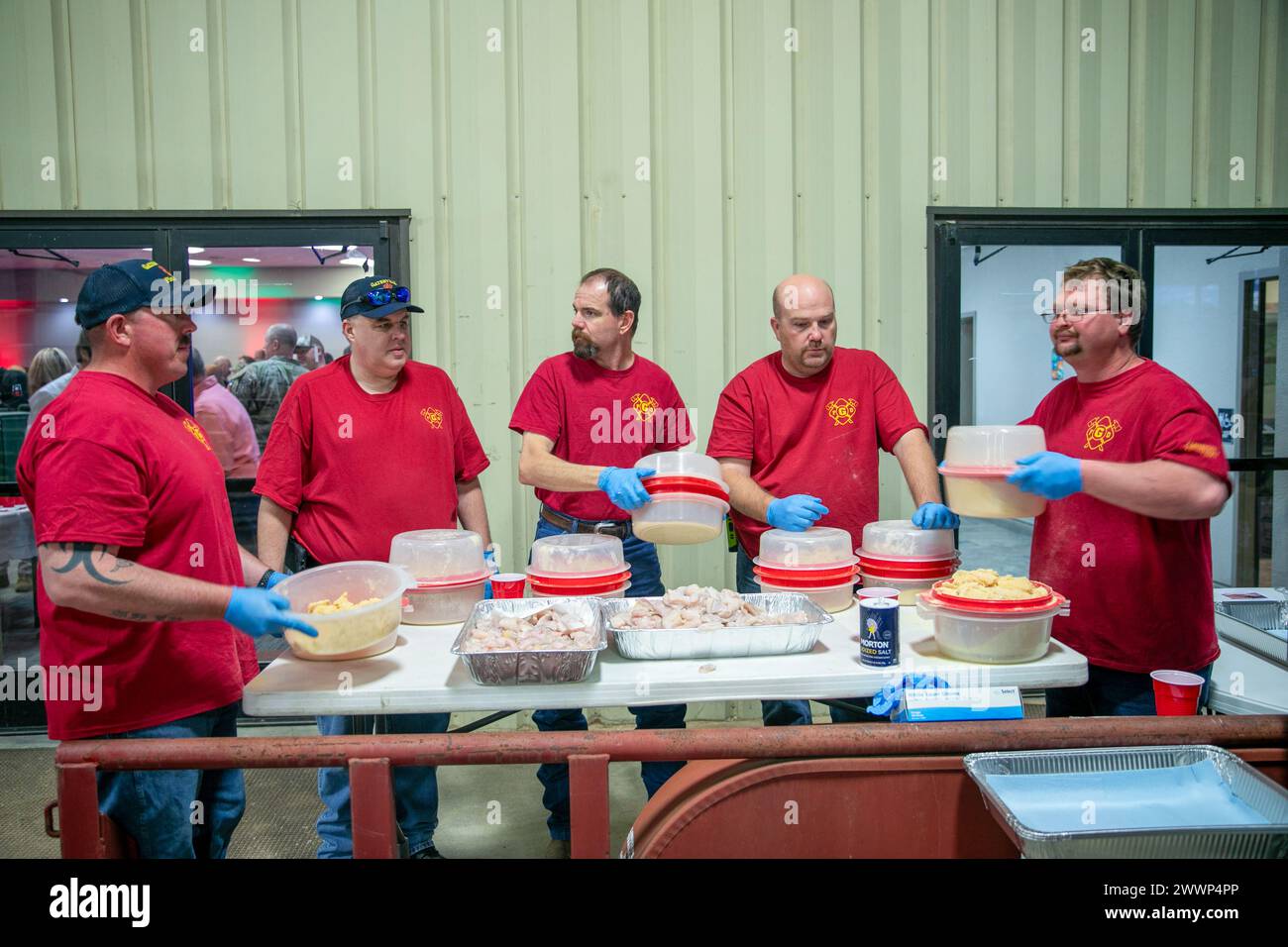 Members of the Gatesville Volunteer Fire Department clean a prepare ...