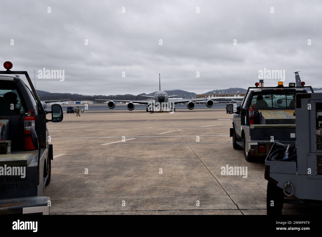 Multiple vehicles of crew chiefs and other flight line personnel ...