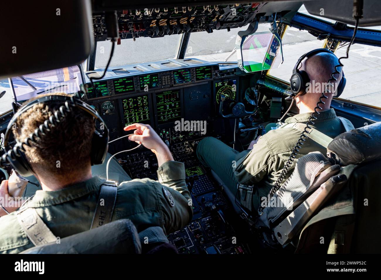 U.S. Marine Corps Capt. Evan Gumbel (left), a pilot with Marine Aerial ...