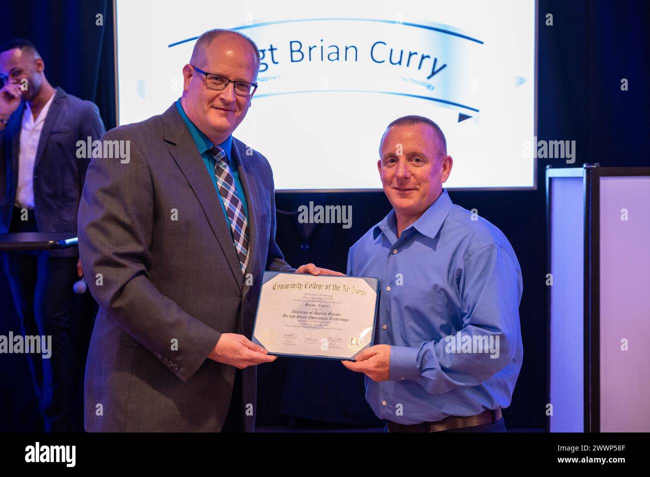 Master Sgt. Brian Curry, receives the Community College of the Air ...