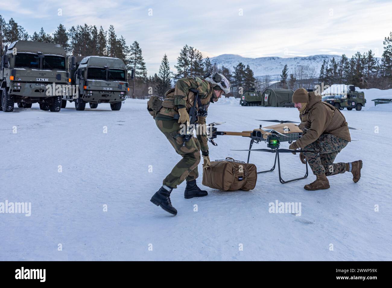 A Norwegian Soldier with the Norwegian Armed Forces retrieves a medical ...