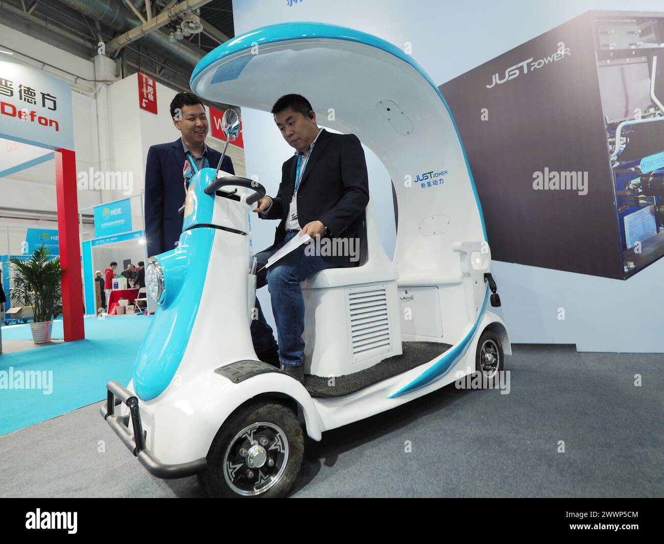 BEIJING, CHINA - MARCH 25, 2024 - Visitors visit a "hydrogen-powered Shared sightseeing car" at ...