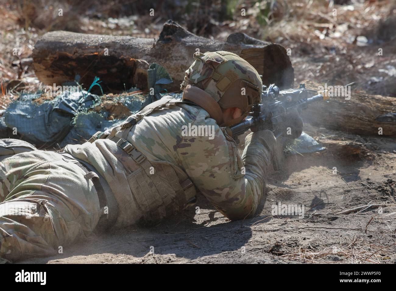 A U.S. Army soldier assigned to the 82nd Airborne Division fires his ...