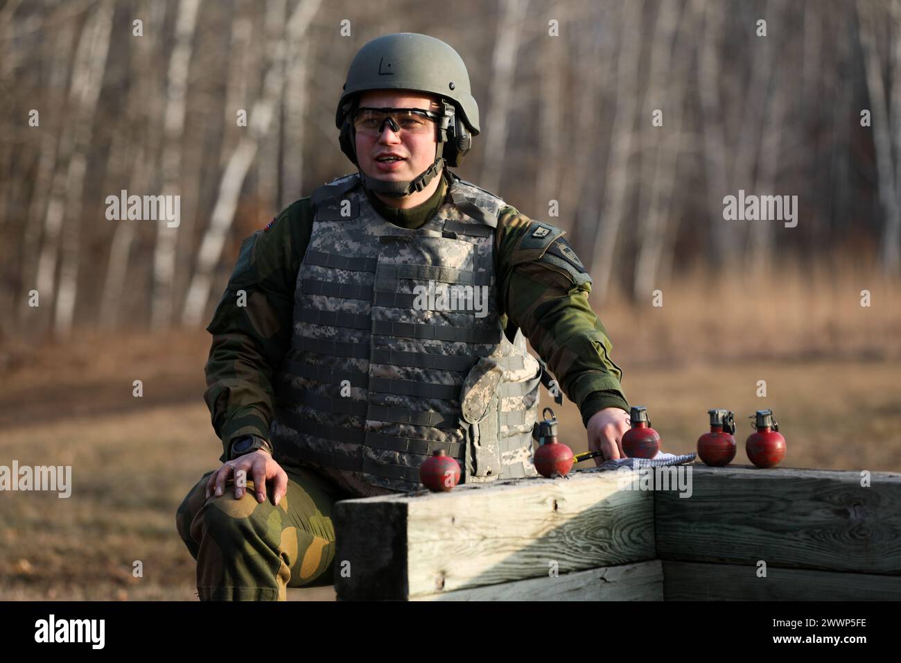 The Norwegian Home Defense Youth throw simulated hand grenades at Camp ...