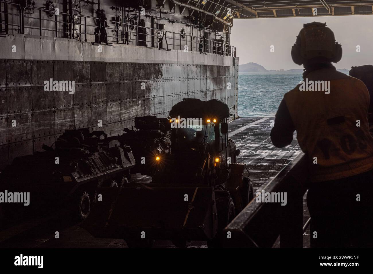 U.S. Marines and Sailors assigned to the amphibious transport dock USS ...