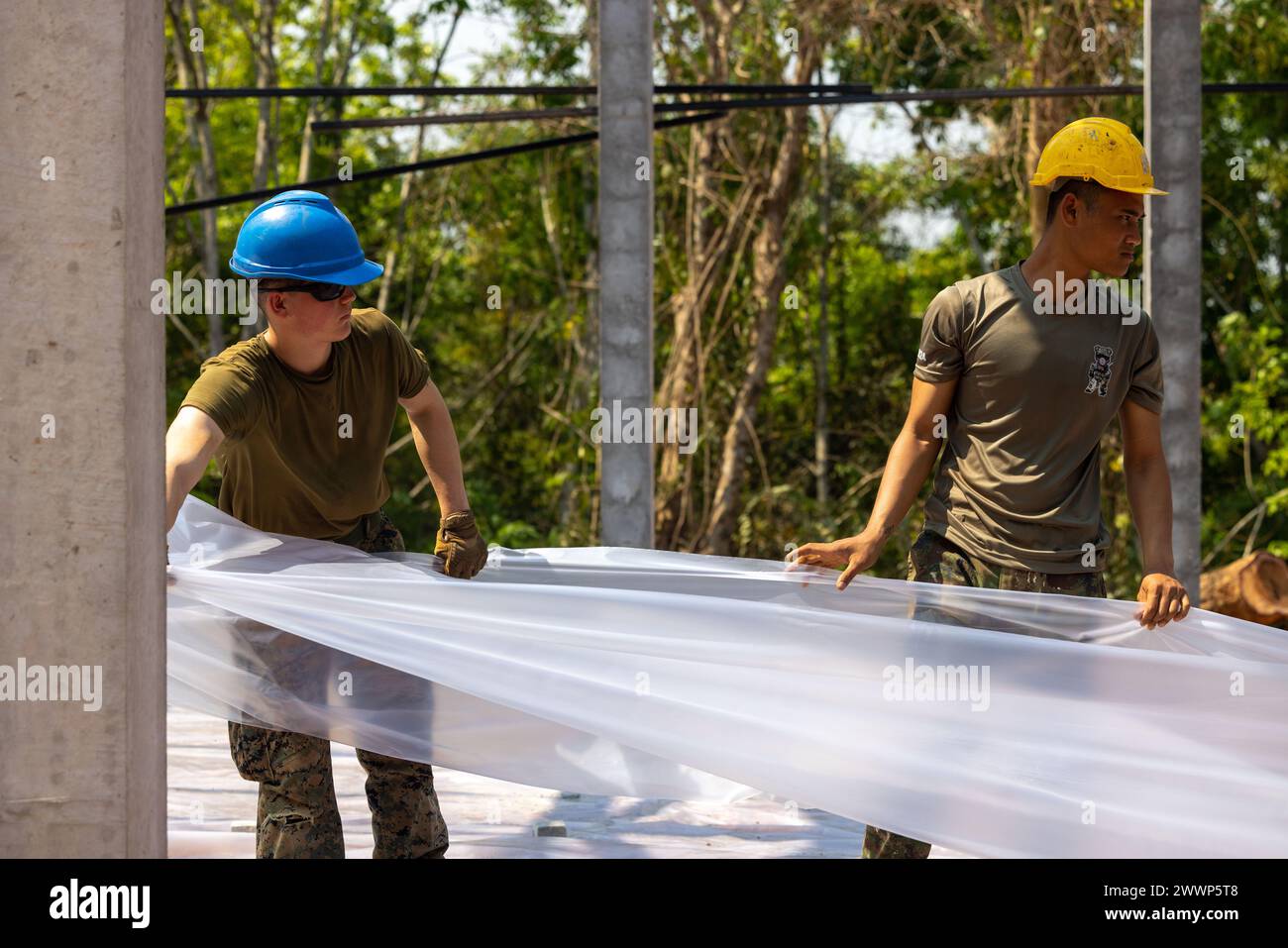 U.S. Marine Corps Lance Cpl. Anakin Crain, left, a combat engineer with ...