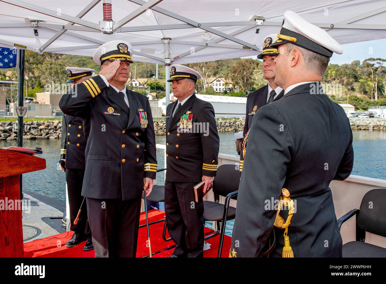 240216-N-SS900-1060 SAN DIEGO (Feb. 16, 2024) Cmdr. Eric Knepper, left ...