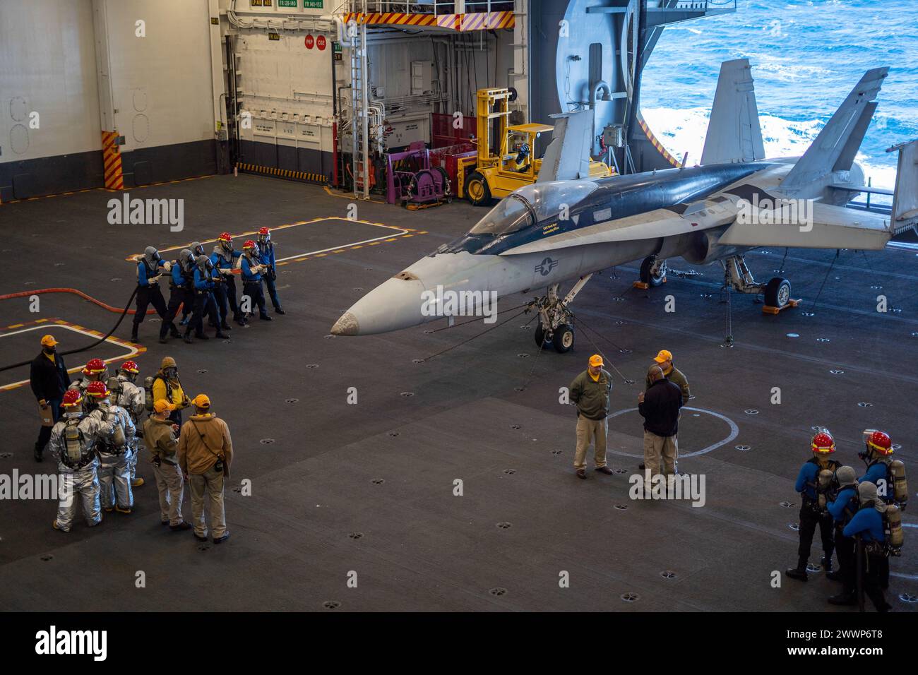 Sailors assigned to air department’s V-3 division participate in a fire ...