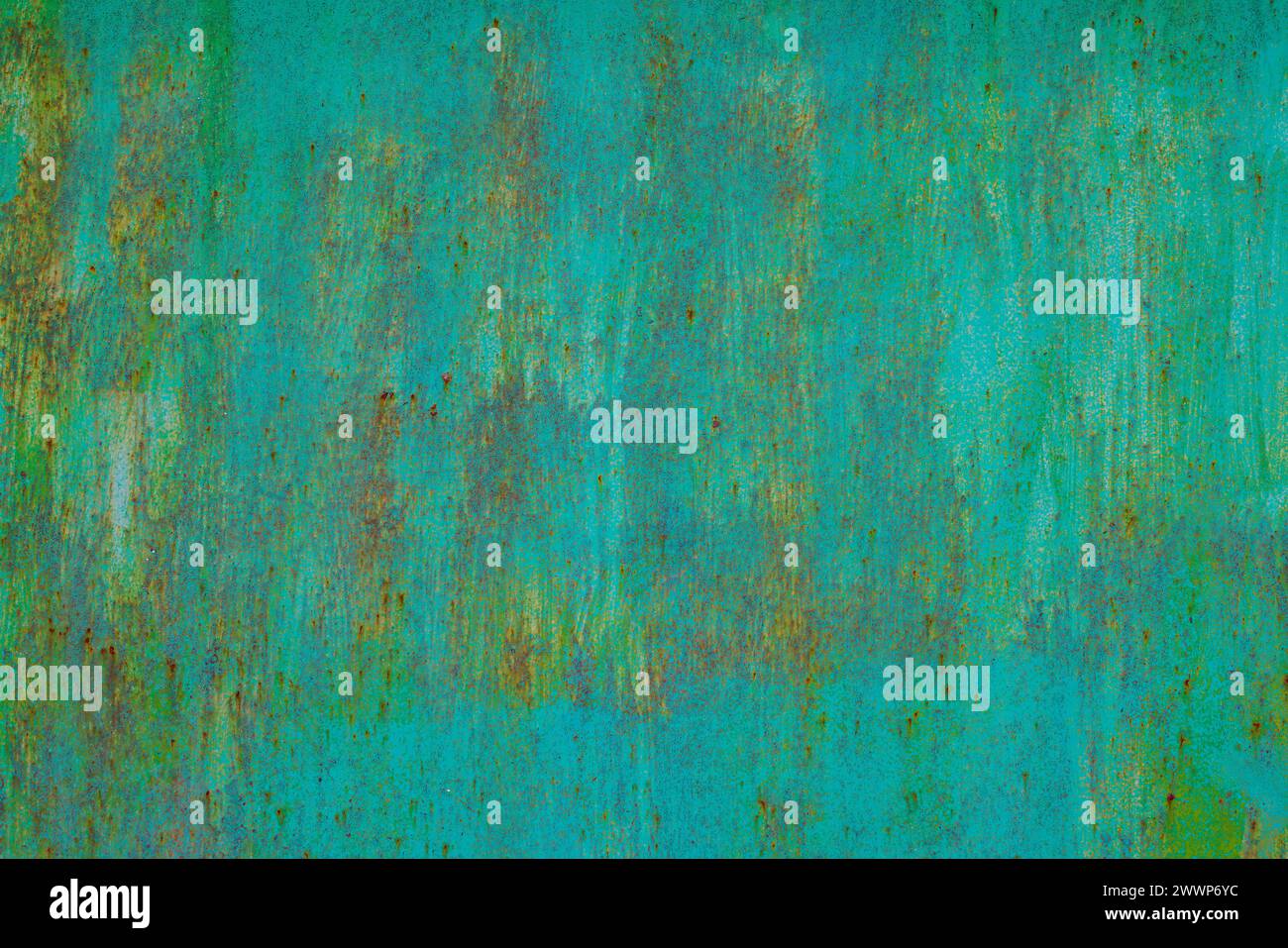 faded green paint on surface of flat sheet steel with stains of rust ...