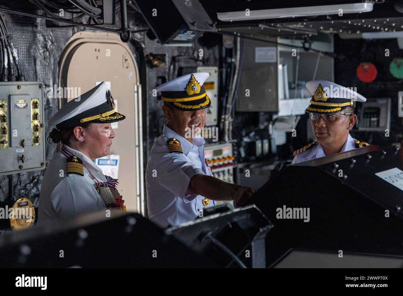 U.S. Navy Capt. Michel Brandt, left, commanding officer of the ...