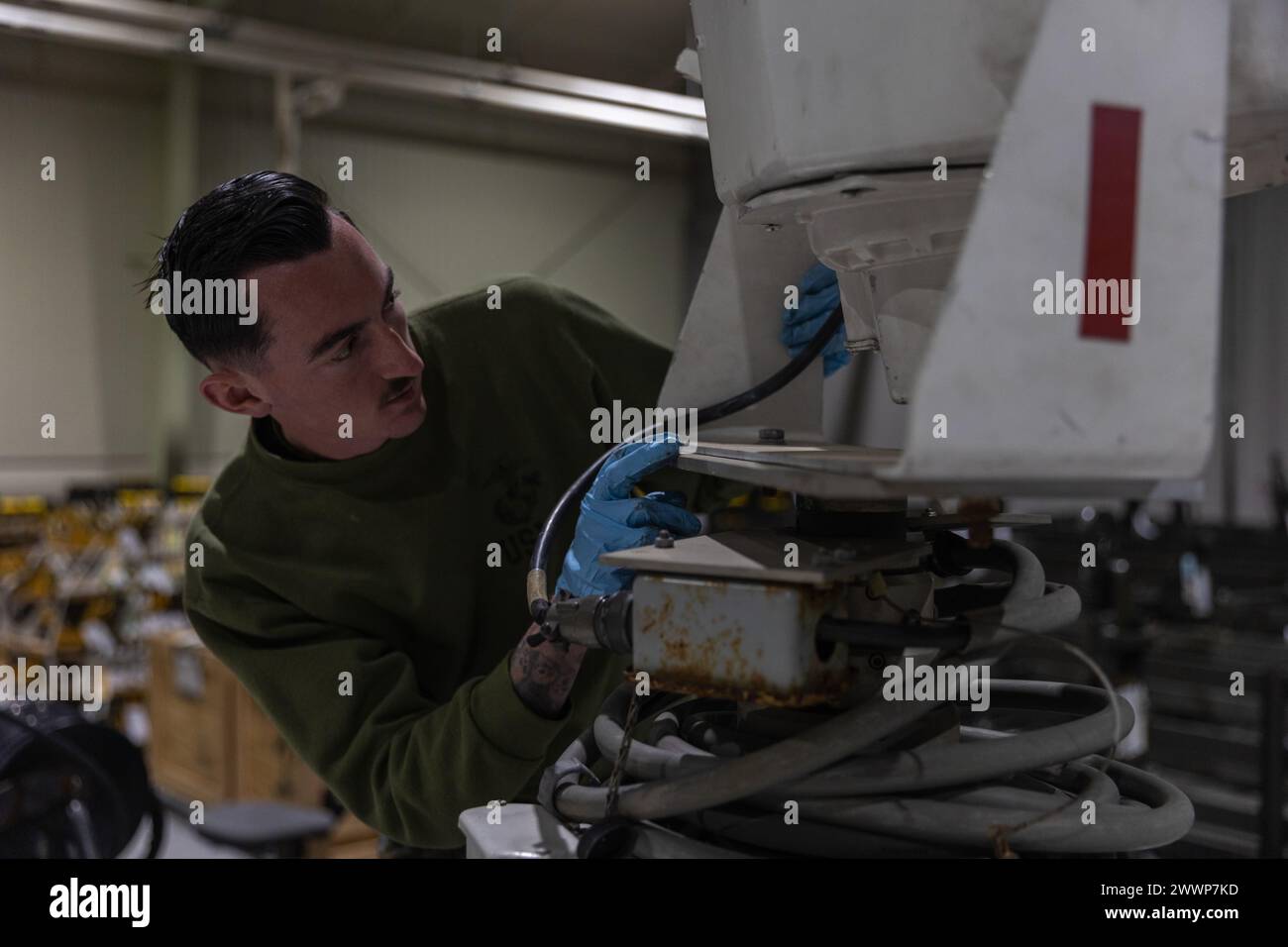 U.S. Marine Corps Cpl. Tron Rhodes, an aircraft maintenance support ...