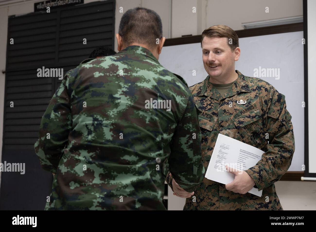 U.S. Marine Corps Gunnery Sgt. Pierce Draper, right, the Humanitarian ...