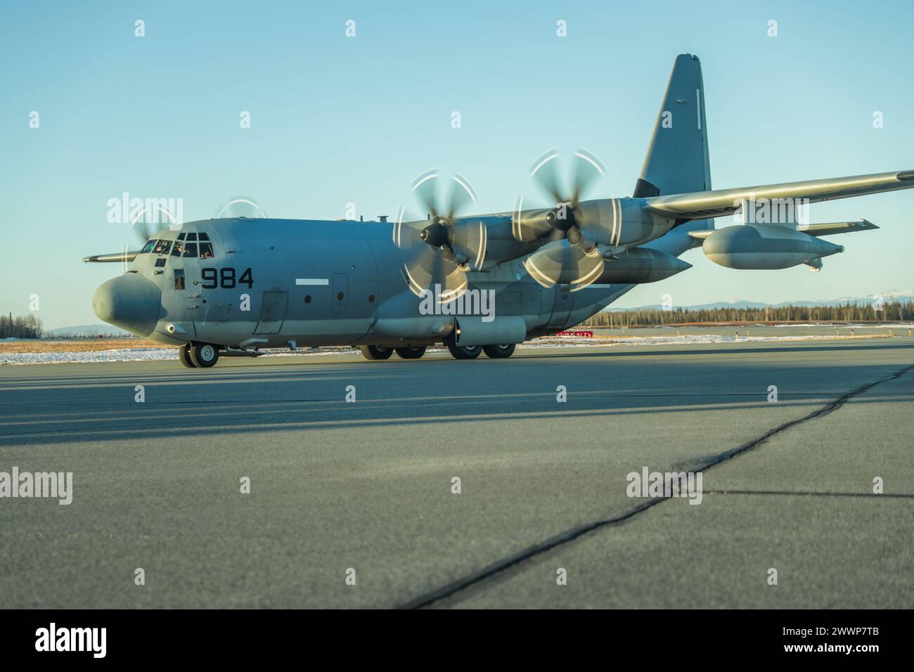 A C-130 Hercules carrying a M142 High-Mobility Artillery Rocket System ...