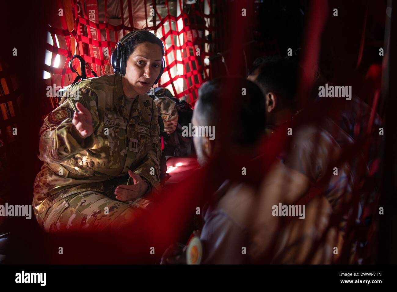 U.S. Air Force Capt. Jes Douglas, 18th Aeromedical Evacuation Squadron flight nurse, briefs ...