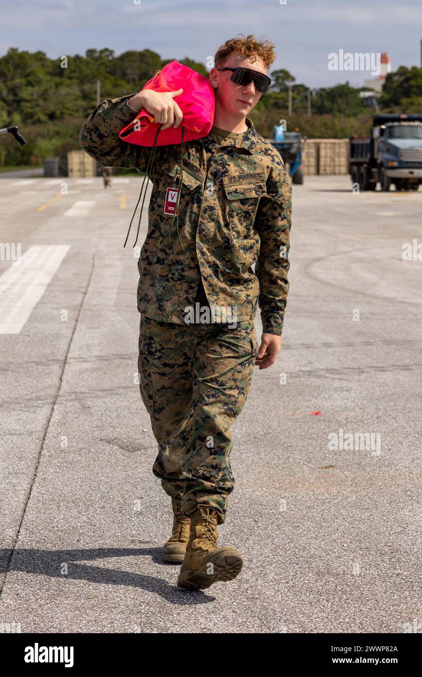 U.S. Marine Corps Lance Cpl. Taylor Warden, an expeditionary airfield ...