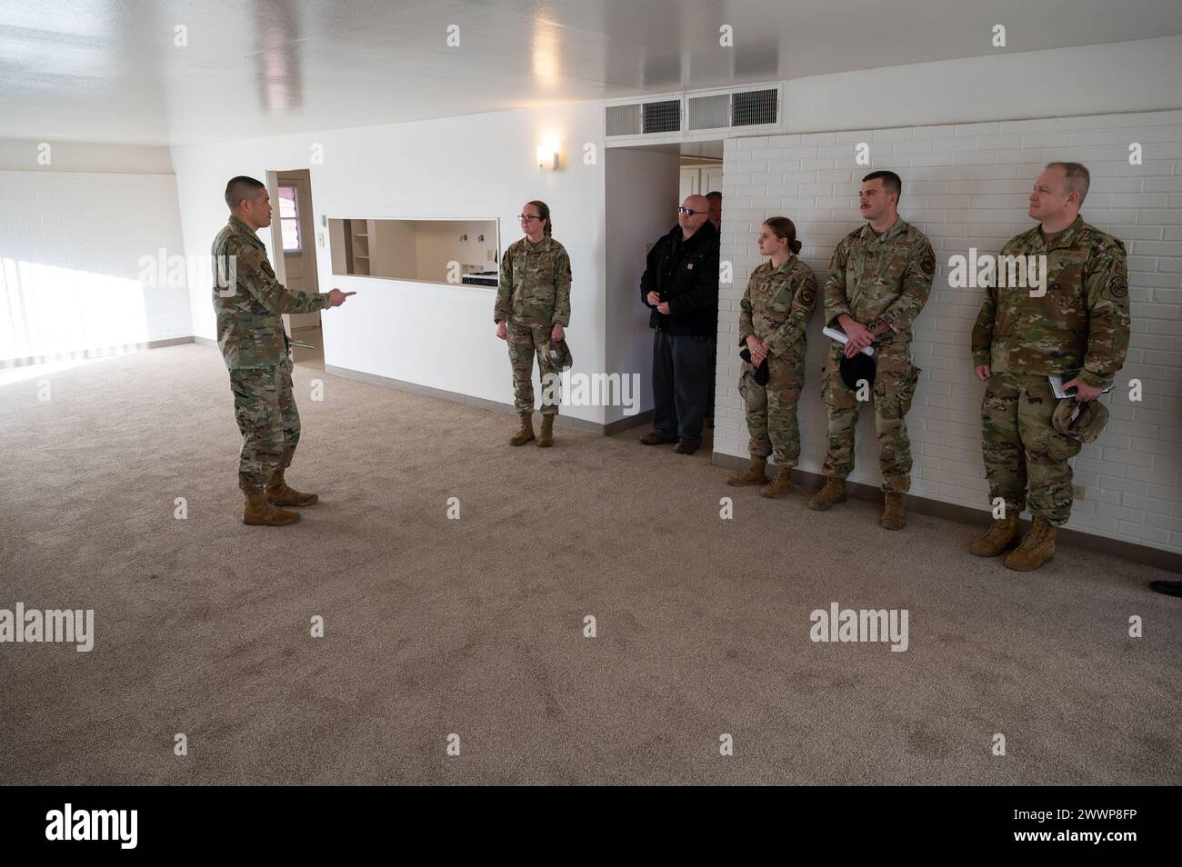 Maj. Gen. Stacy J. Huser, 20th Air Force commander, talks with Col ...