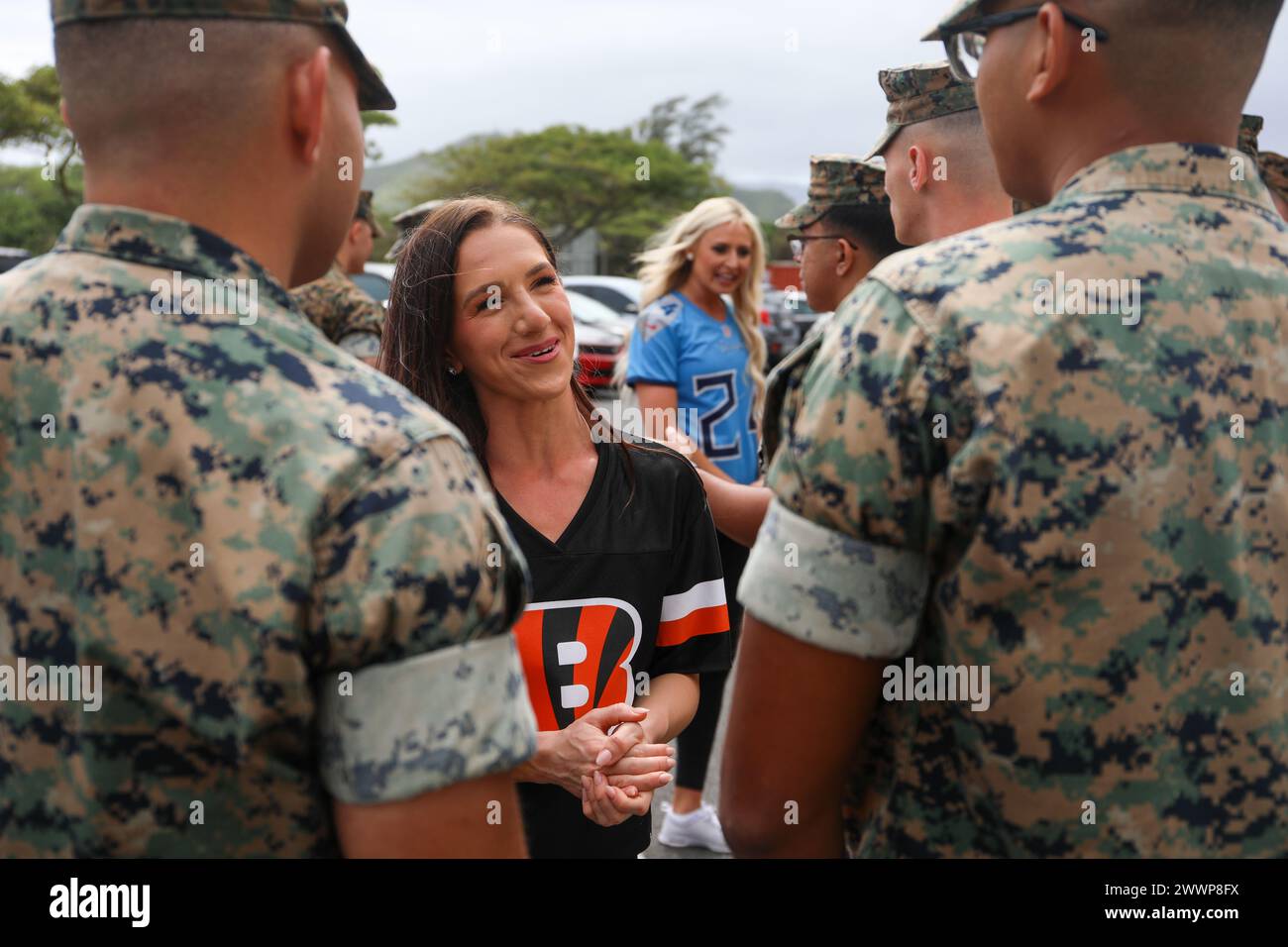 NFL cheerleader Delaney Wilder talks to Marines during the Armed Forces ...