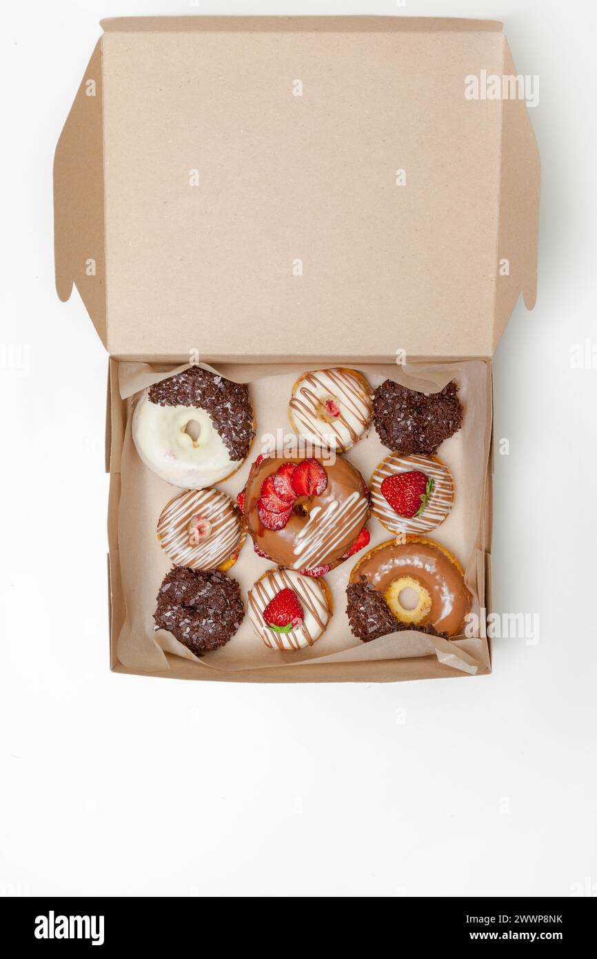 box of fresh donuts isolated on white Stock Photo - Alamy