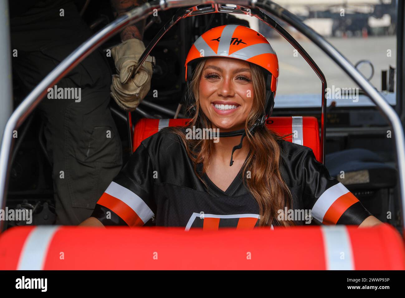 NFL cheerleader Kayley Sulc sits in a rescue basket during the Armed ...