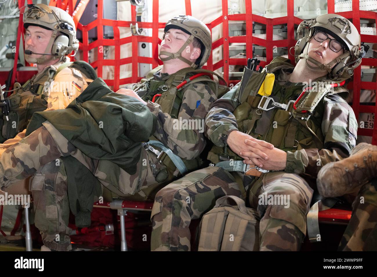 Amman, Jordan. 25th Mar, 2024. Soldiers dozing on board a C-130 ...
