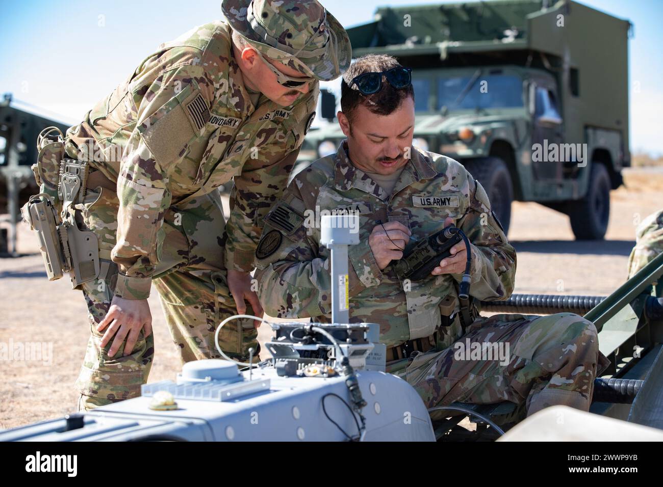 U.S. Army Staff Sgt. James Novobilsky and Sgt. Vincent Cicala, assigned to Delta Co., 104th ...