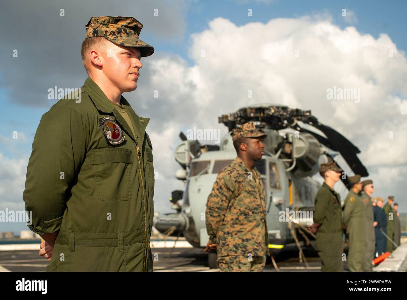 U.S. Marine Corps Lance Cpl. Aaron Seay, left, a CH-53E Super Stallion ...