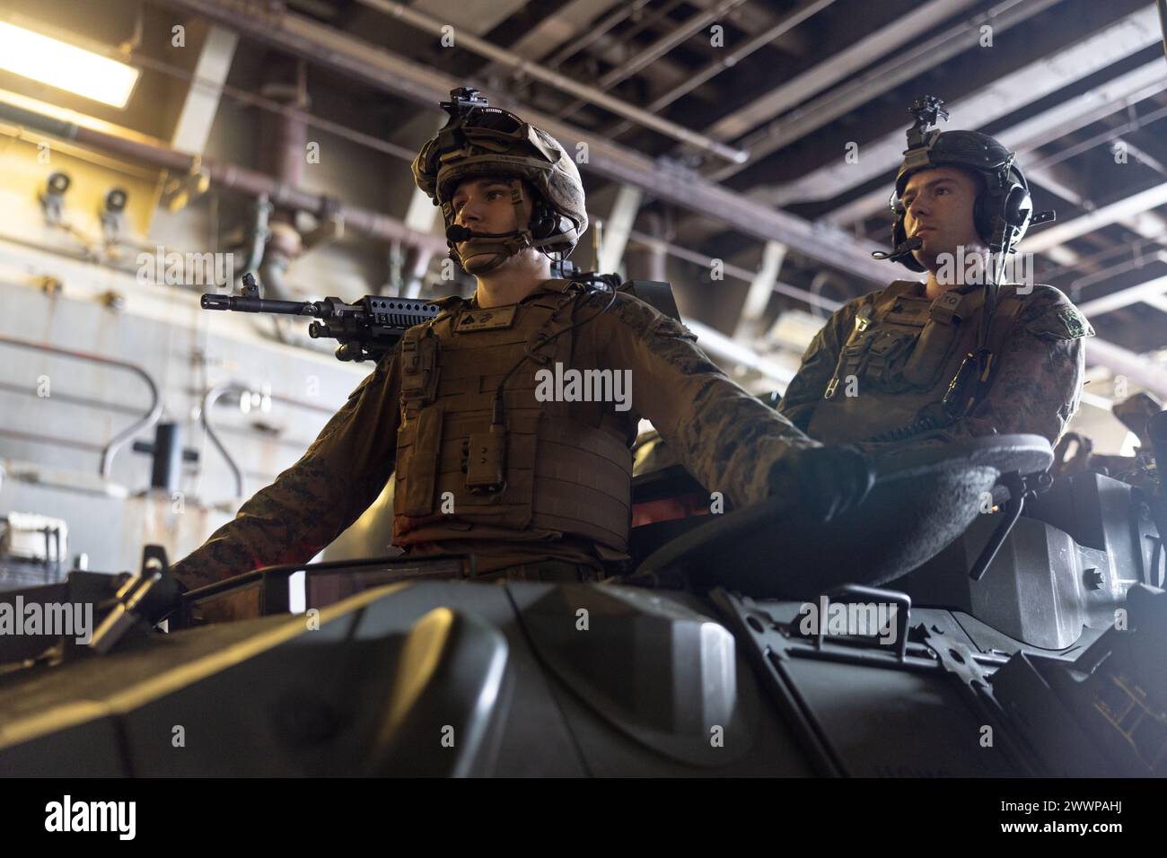 U.S. Marine Corps Cpl. Gregory Bolner, left, a light armored vehicle ...