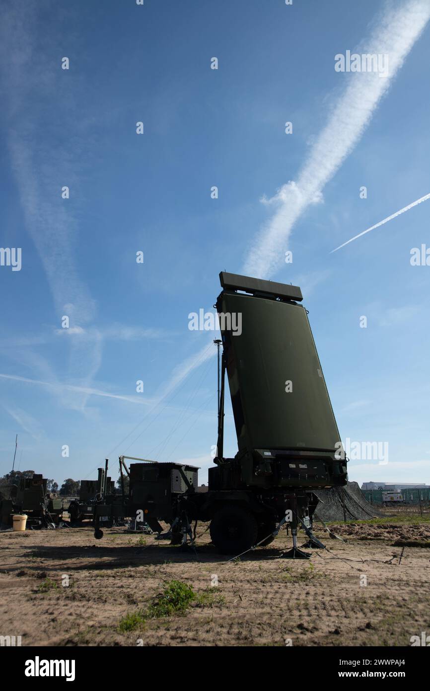 Military personnel and civilians prepare equipment to assist in ...