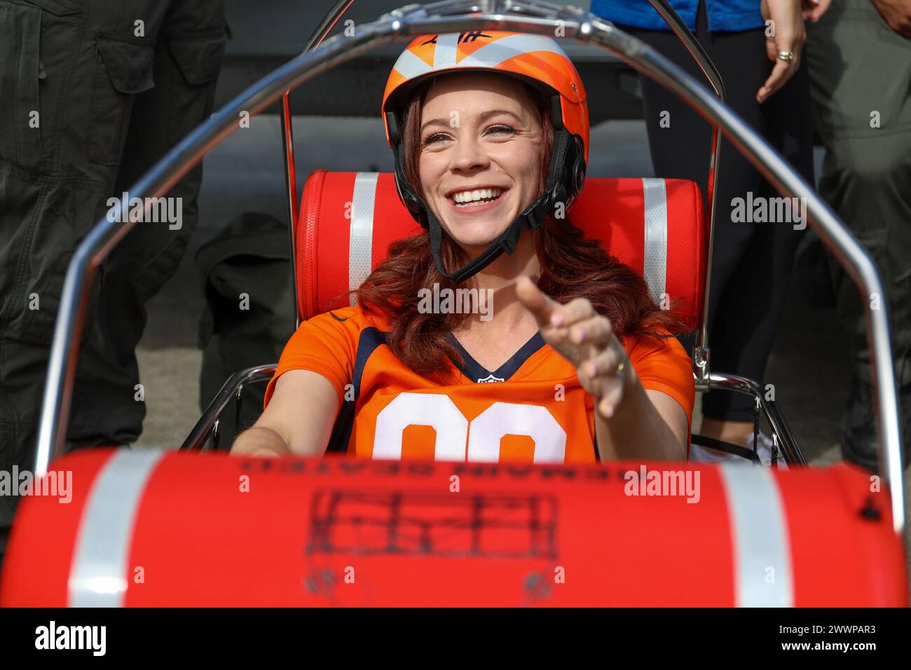 NFL cheerleader Mary Naylor sits in a rescue basket during the Armed ...