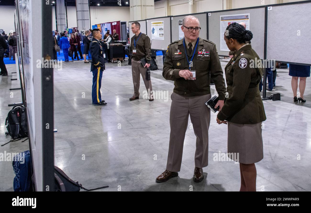 U.S. Army Lt. Col. Tanisha Currie presented her poster to the U.S. Army ...