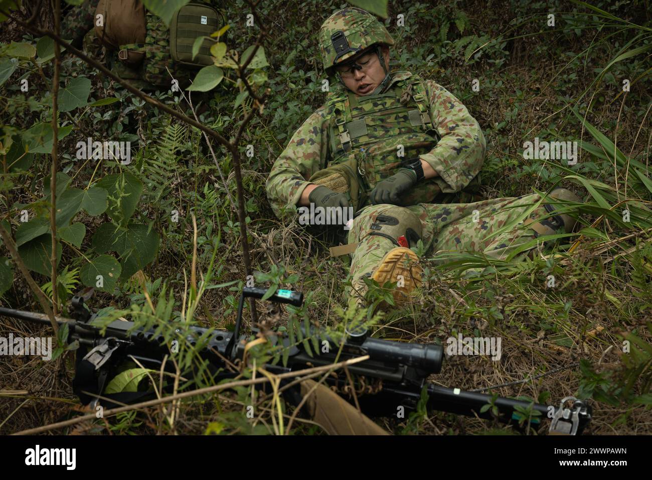 Japan Ground Self-Defense Force soldier Sgt. Daiki Kubo, a machine ...