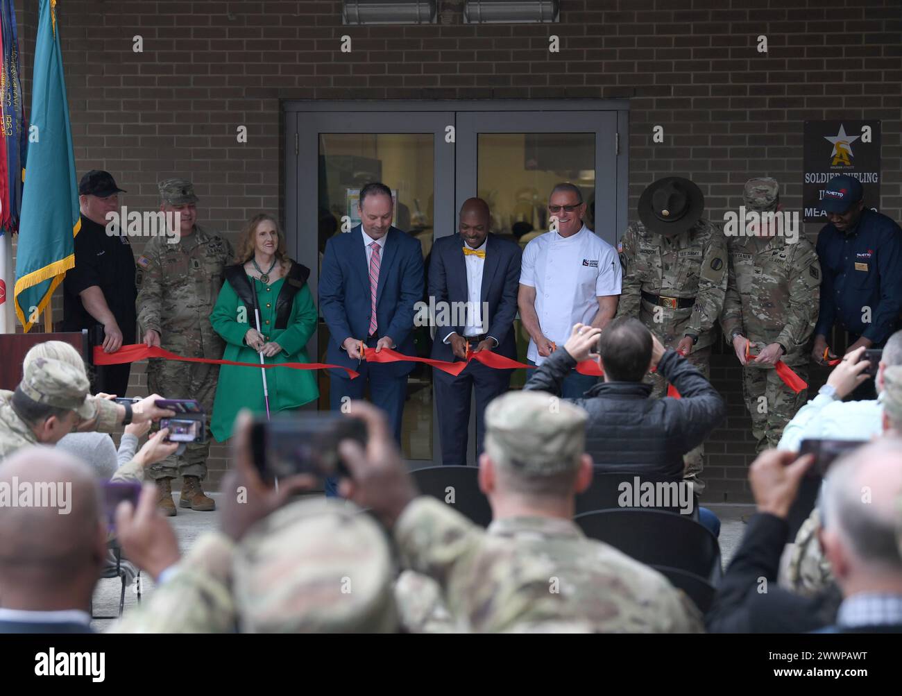 A group of dignitaries including Robert Irvine, Post Command Sgt. Maj ...