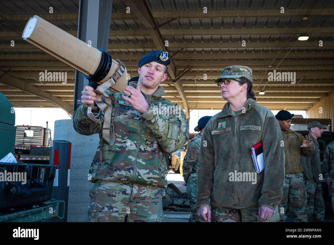Maj. Gen. Stacy Huser (right), 20th Air Force commander, listens to ...