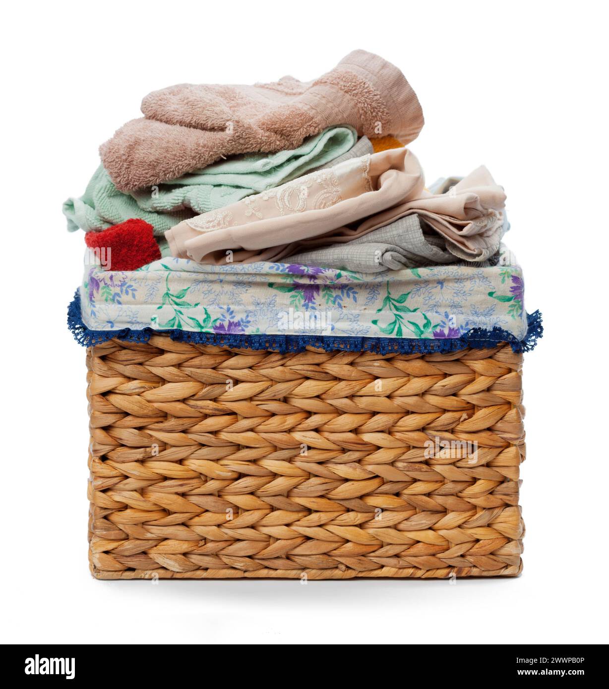 Clothes in a laundry wooden basket isolated on white background Stock ...