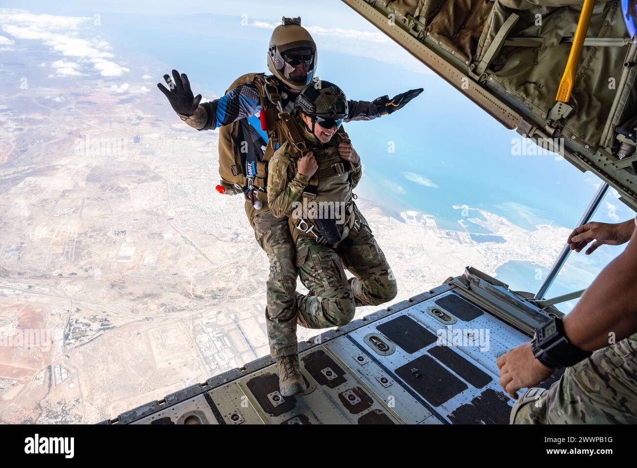 U.S. Air Force members assigned to the 82nd Expeditionary Rescue Squadron conduct a tandem High ...