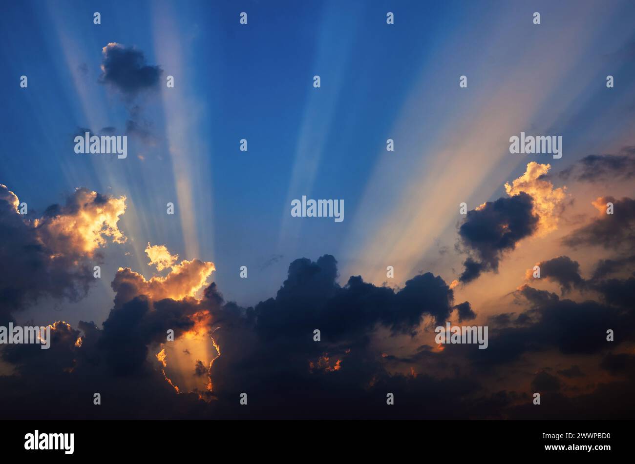 Sunlight shining through the dark clouds Stock Photo - Alamy