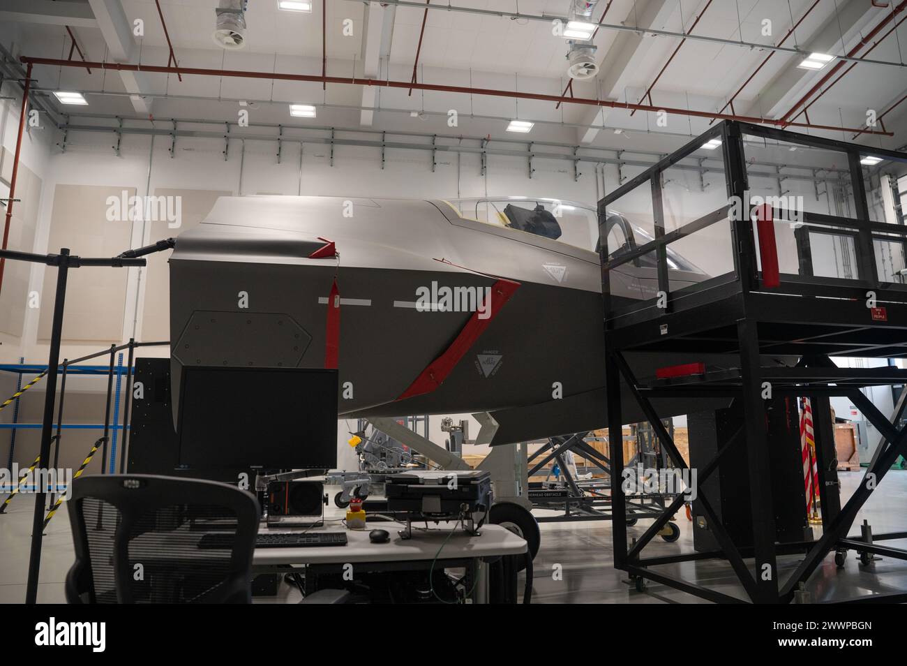 A new Egress System Maintenance Trainer is unveiled during a ribbon ...