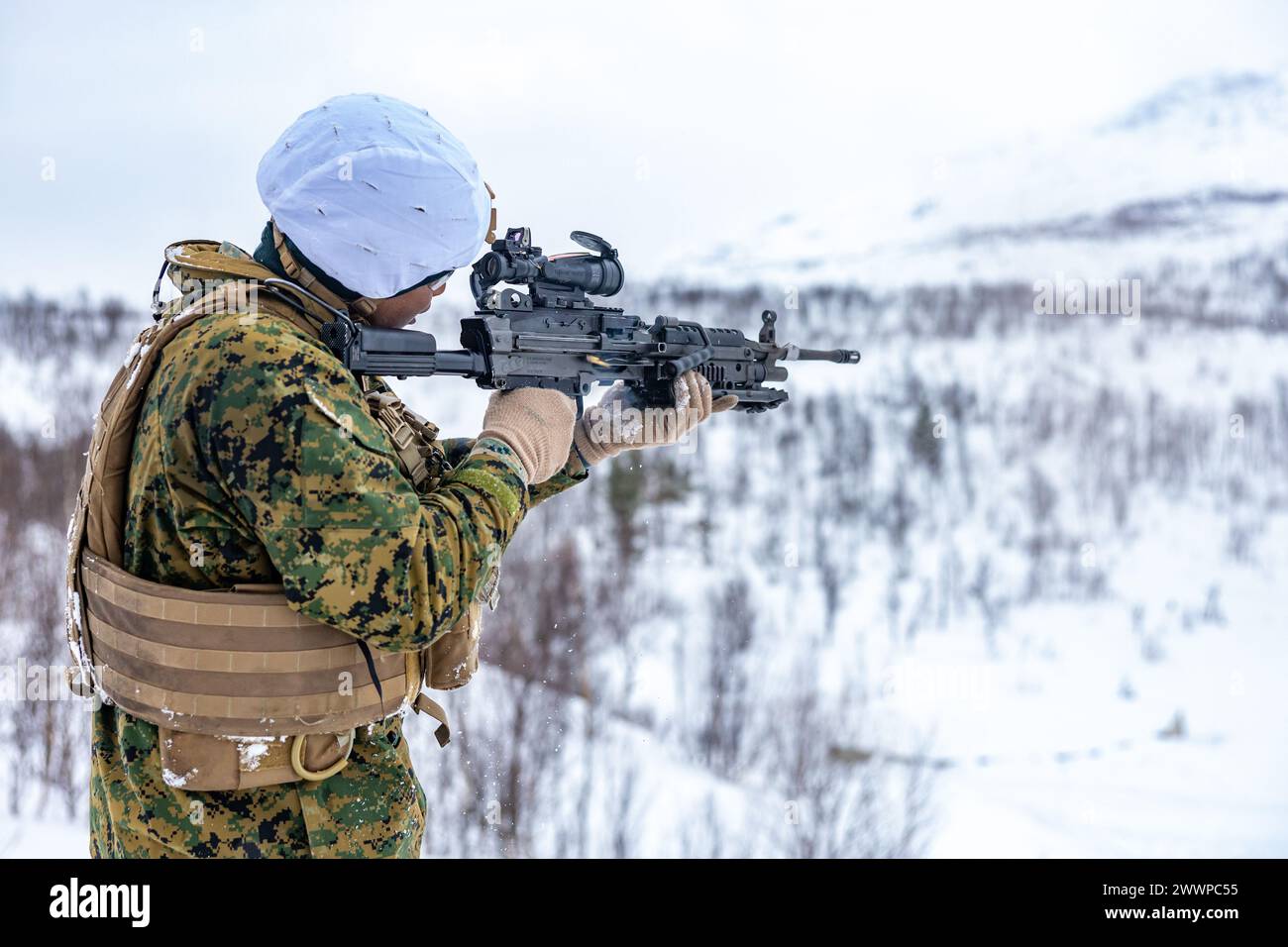 U.S. Marine Corps Lance Cpl. Christian Salazar, a combat photographer ...