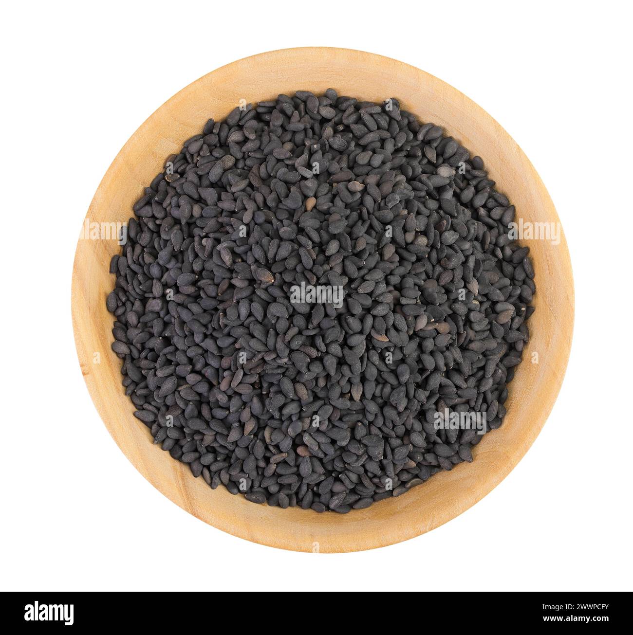 black sesame seeds in wooden bowl isolated on white background. Top ...