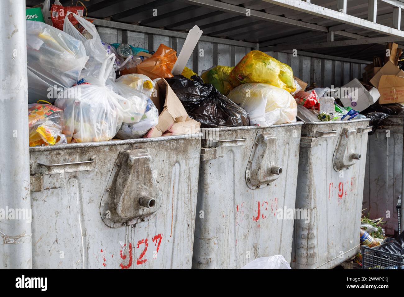 overfilled public trash bins at summer day in Bishkek, Kyrgyzstan Stock ...