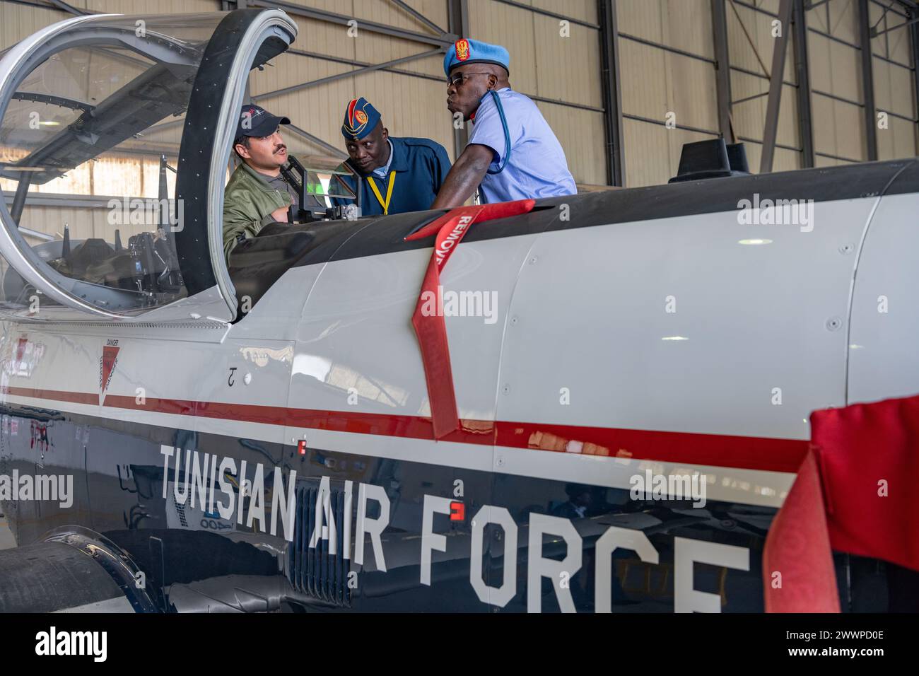 A Tunisian Air Force airman, left, showcases aircraft instruments to ...