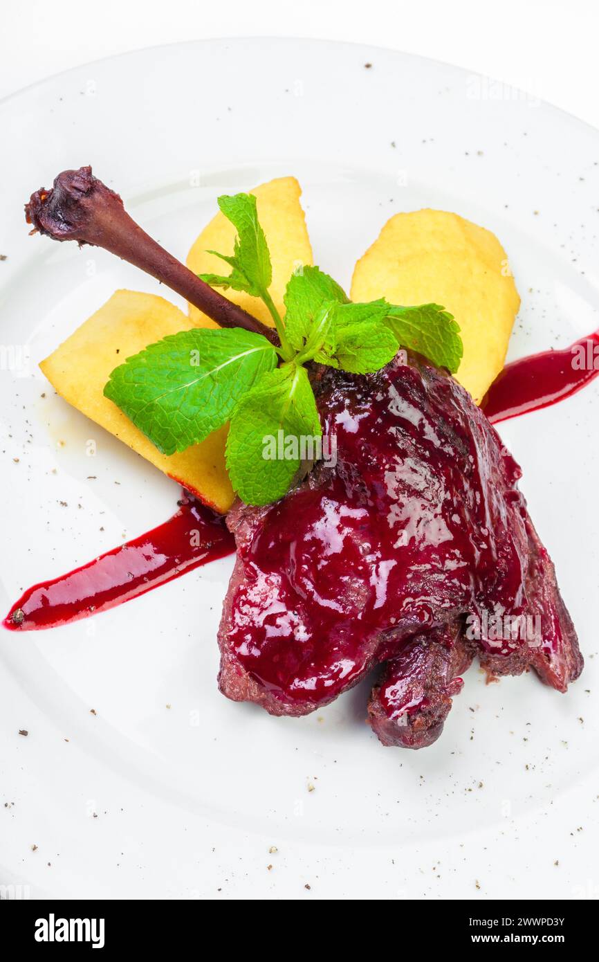 Culinary roast duck on plate isolated on white background Stock Photo ...