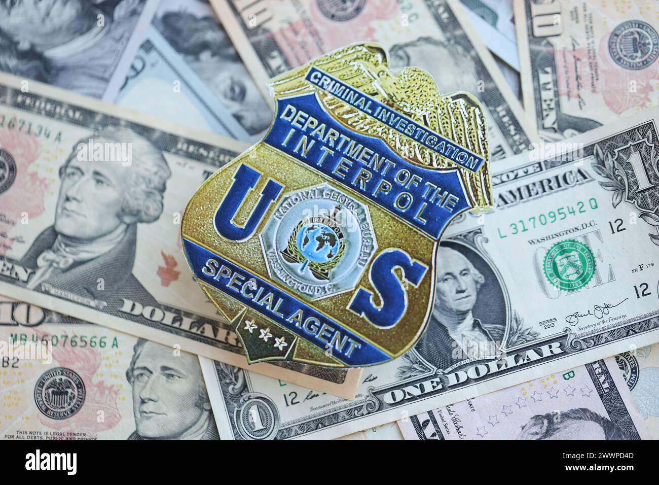 KYIV, UKRAINE - MARCH 9, 2024 US Interpol Special Agent badge on many ...