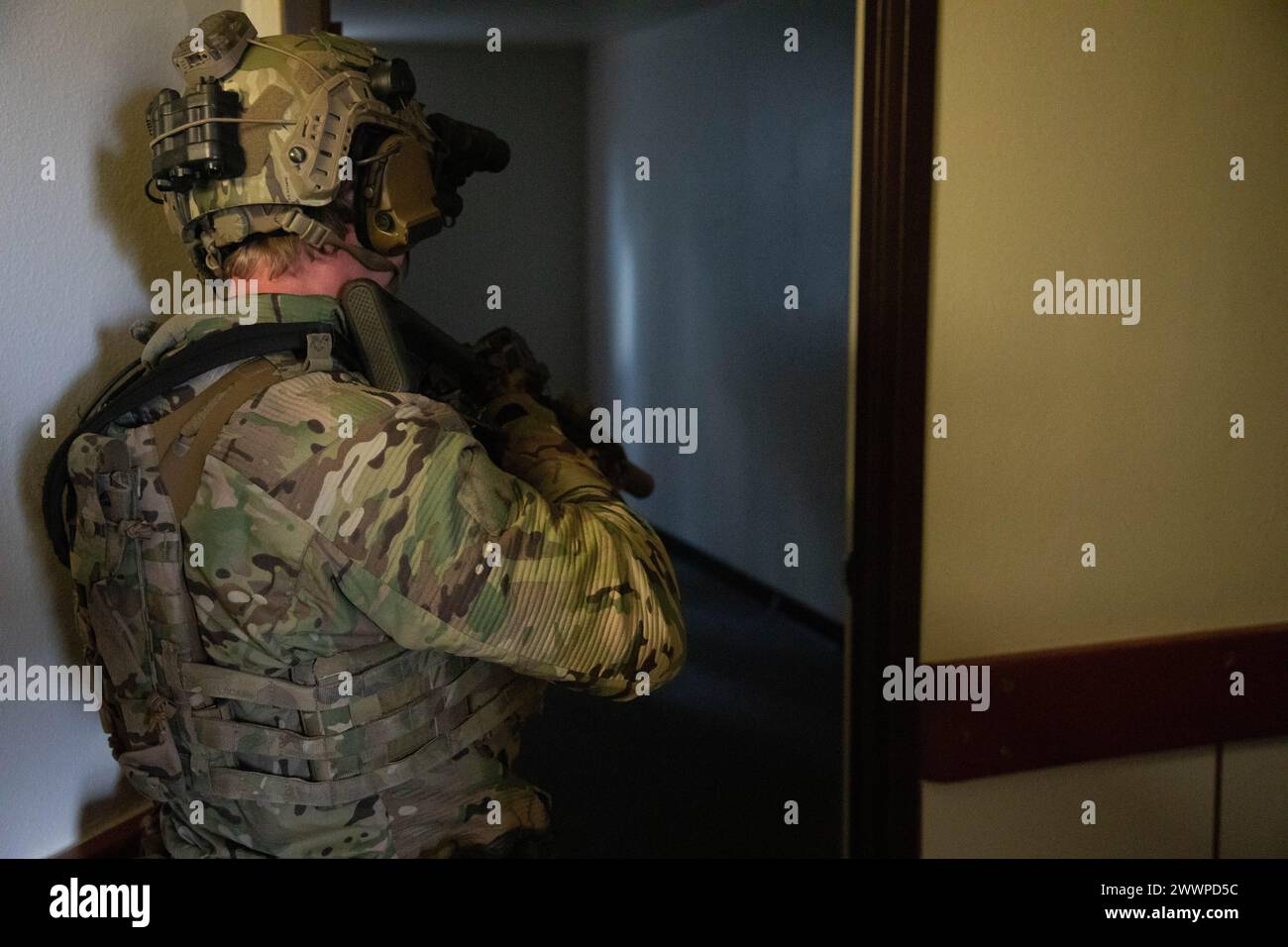 A U.S. East Coast-based Naval Special Warfare Operator (SEAL) clears a ...