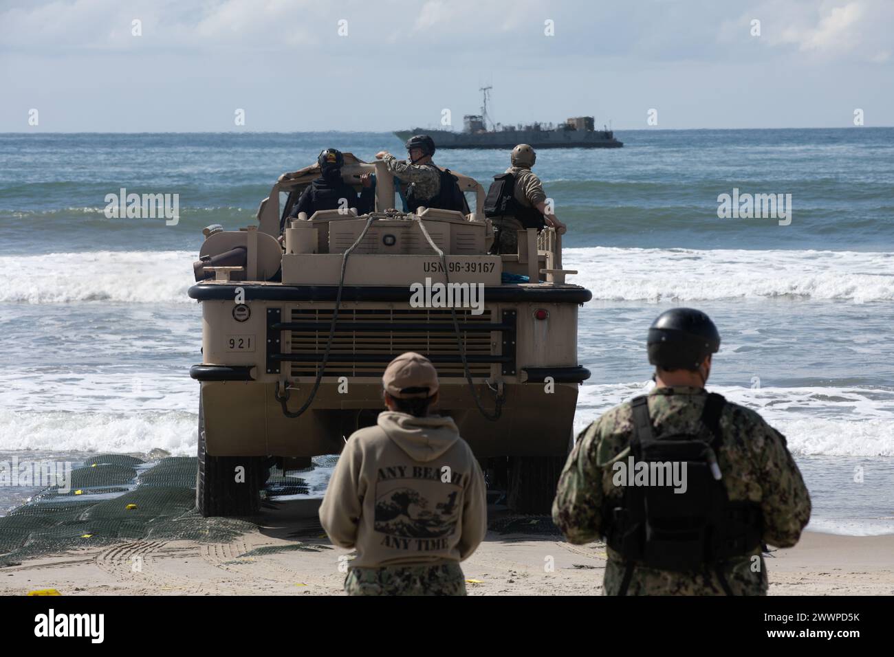 U.S. Sailors assigned to the Beach Master Unit 1 and the Amphibious ...